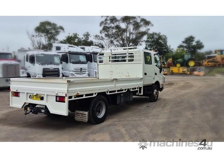 Buy Used Hino 2022 Hino 300 Series 2 Crew Cab Wide Tray Truck Trucks (1114790) - Listed on ...